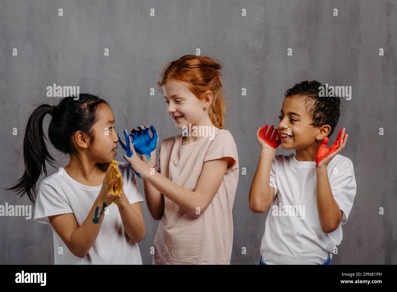 Portrait of happy kids with finger colours and painted hands Stock ...