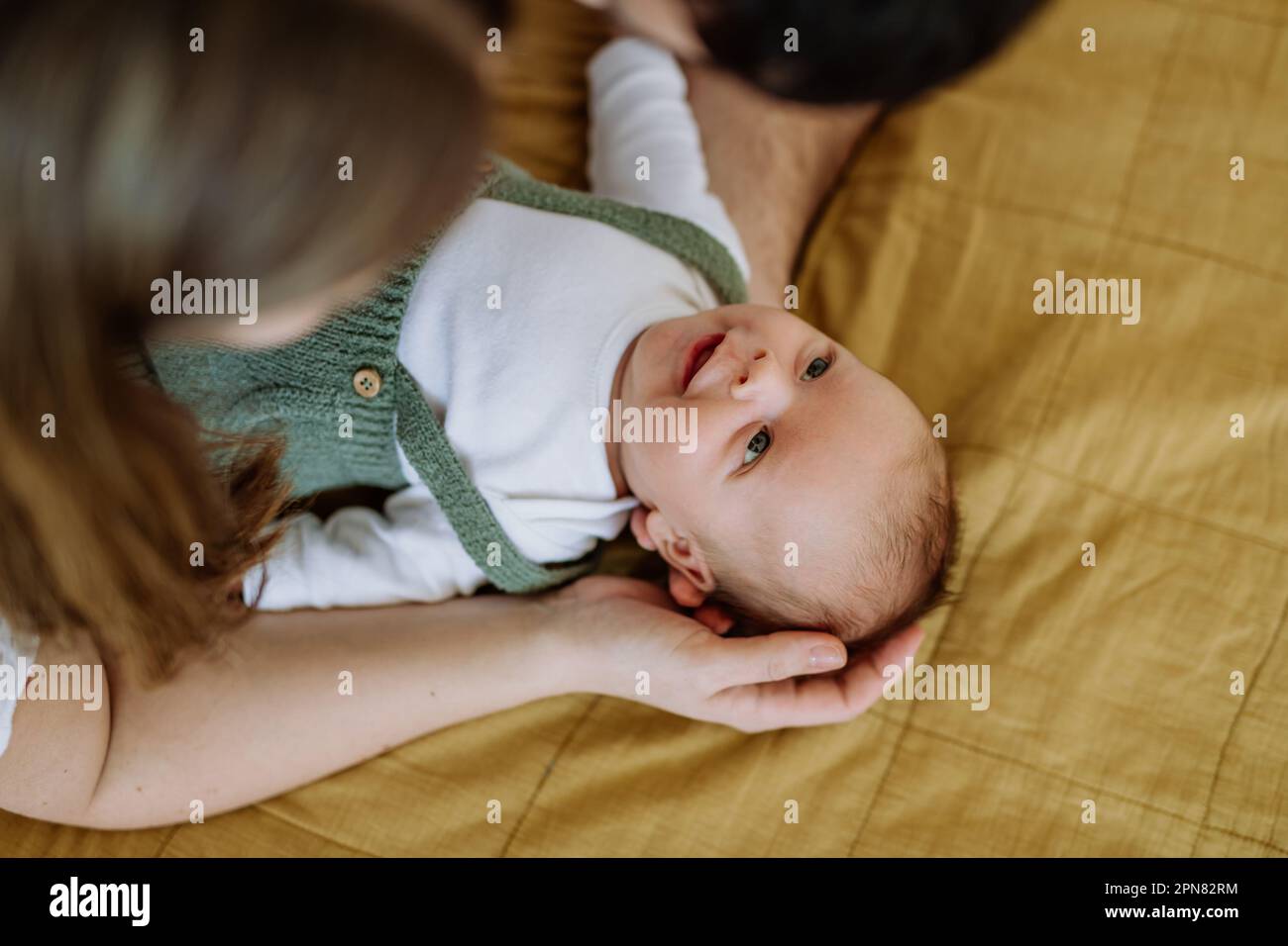 Happy parents cuddling with their newborn baby Stock Photo - Alamy