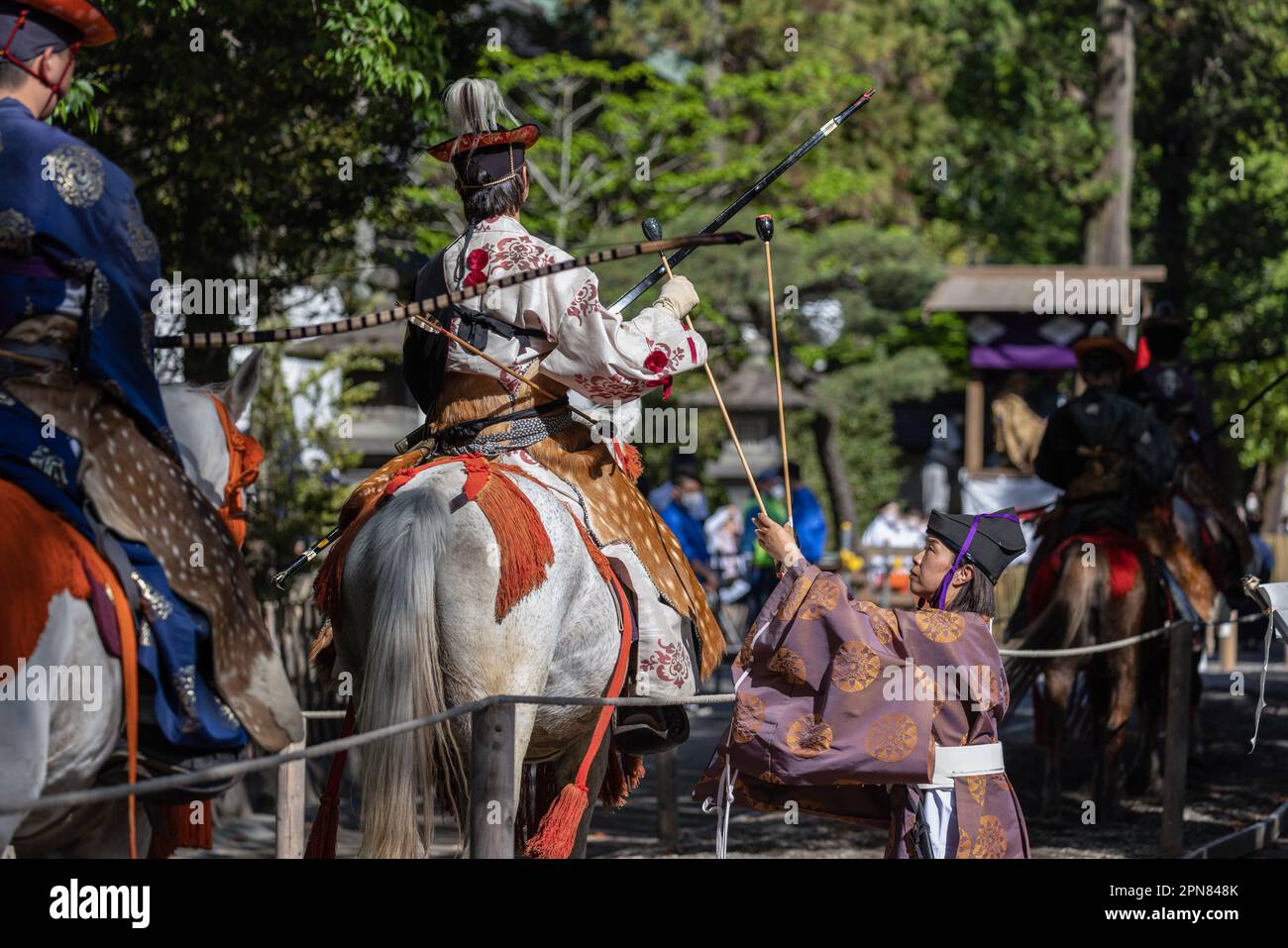 Yabusame (Japanese horseback archery) tournament official returns an ...