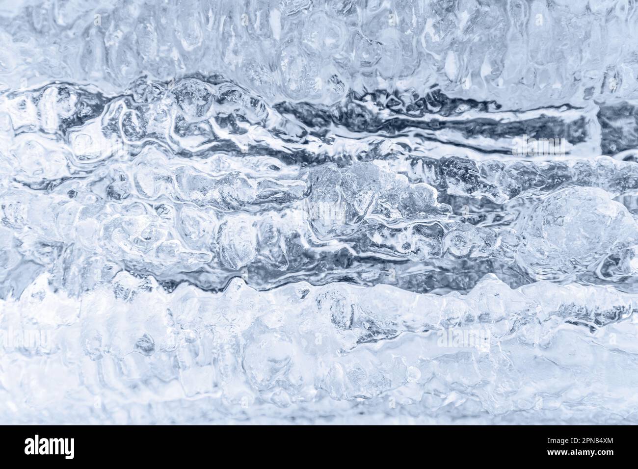 Blue ice and icicles on the rocks of frozen waterfall. Great natural ...