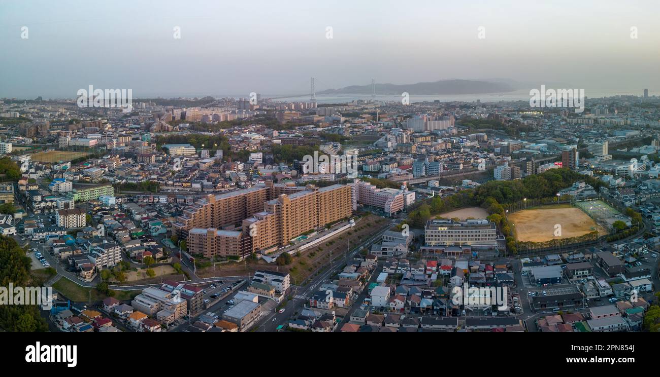 Aerial view of Akashi City buildings and bridge to Awaji Island at ...