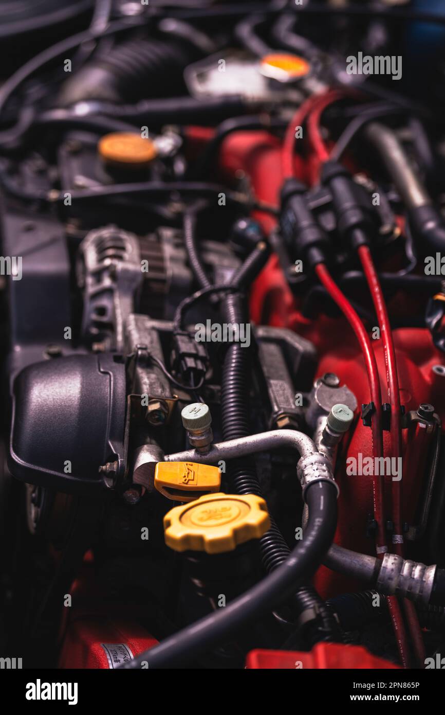 A vertical shot of details on the interior of a car engine Stock Photo ...