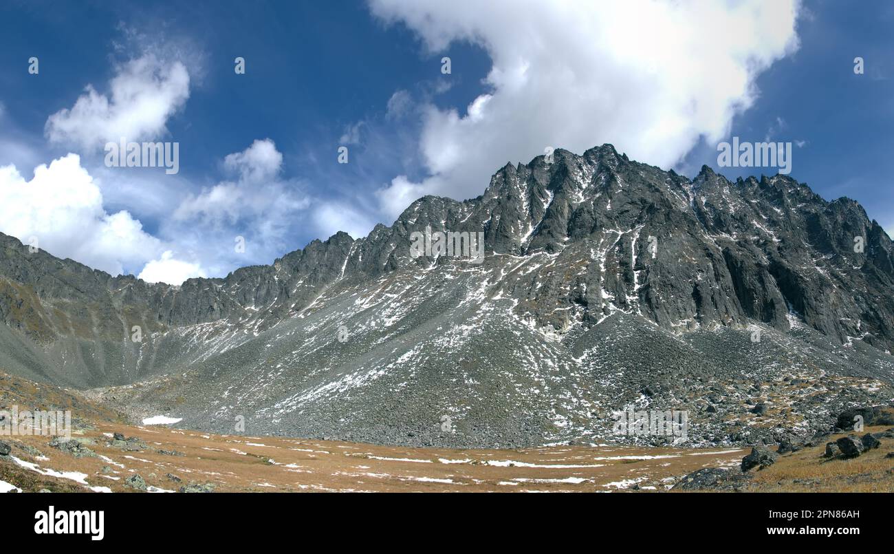 Orography, geology. Saddle back of the side ridge and picturesque snowy ...