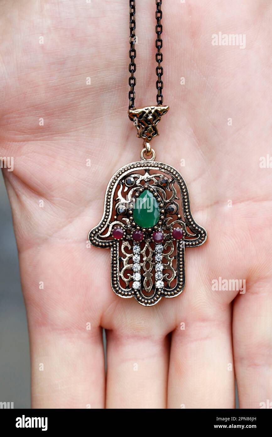 Closeup of a muslim hamsa amulet, also known of the hand of fatima or ...