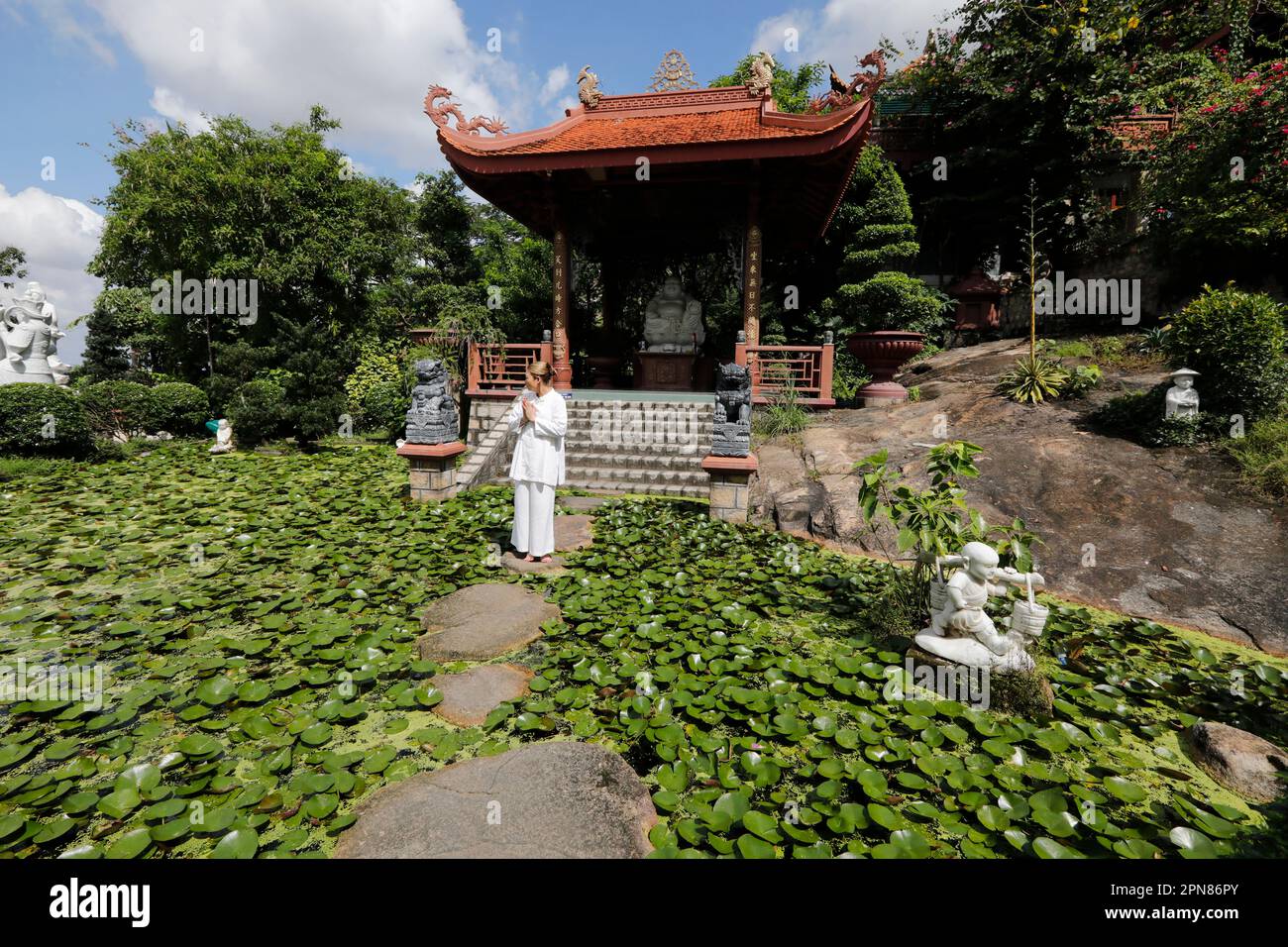 Phat Quang Buddhist temple. Temple pond with stones and water lilies ...