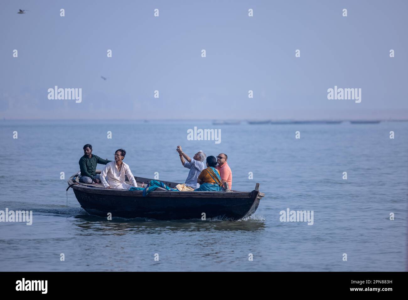 Varanasi, Uttar Pradesh, India - November 2022: Tourists enjoying boat ...
