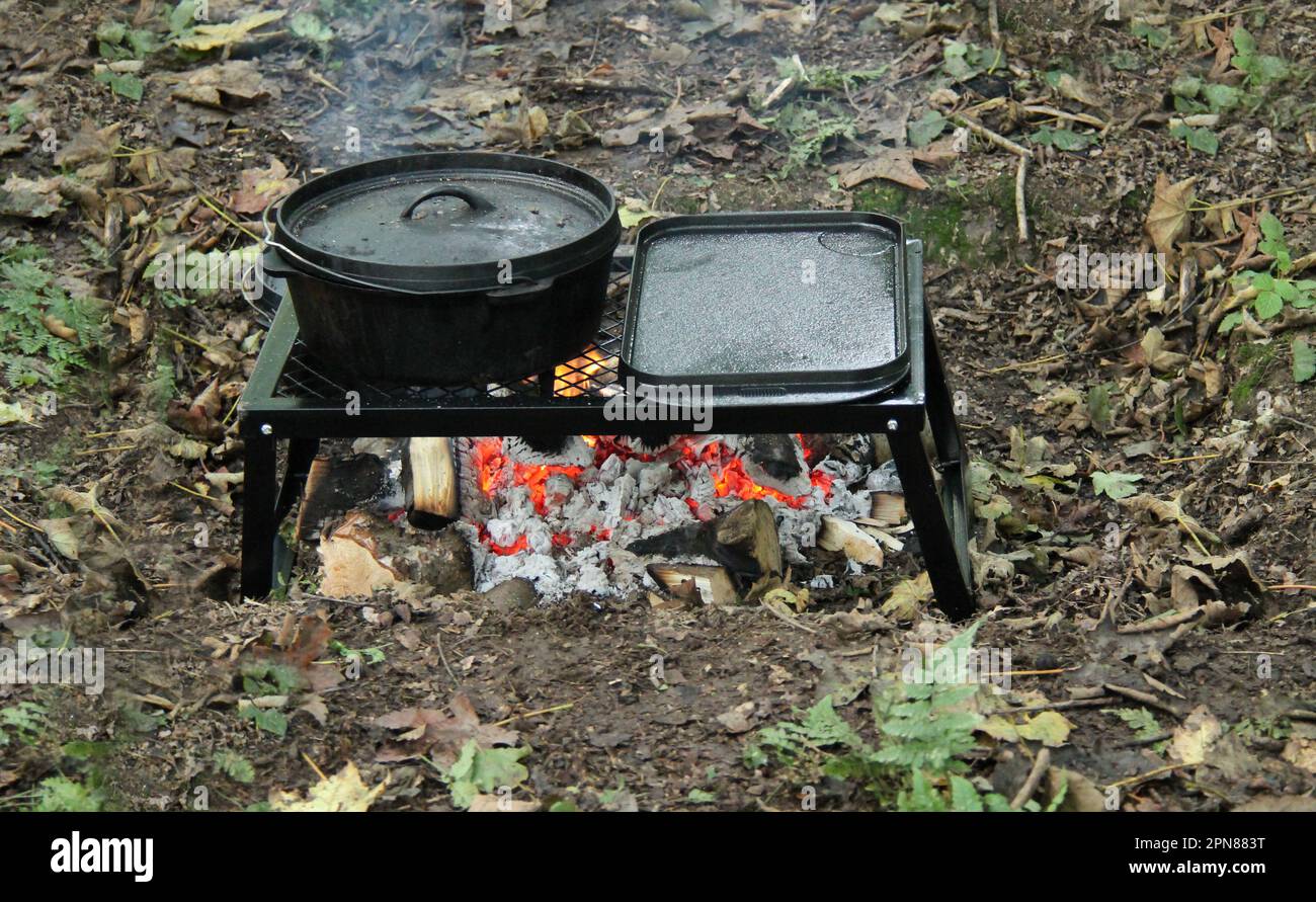 Cooking on an Open Wood Fire in a Woodland Setting Stock Photo - Alamy