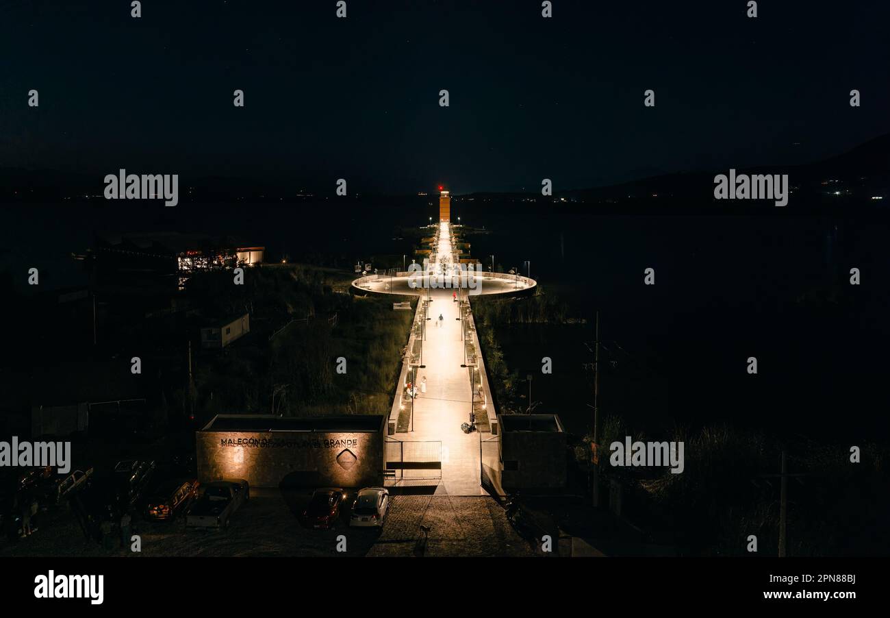 An aerial photograph of a street with bright street lights illuminating ...