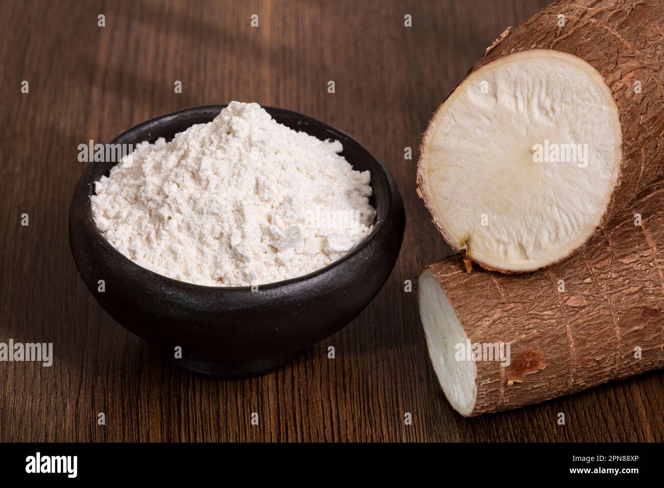Raw Cassava Root And Starch - Manioc Esculenta; On Wooden Background ...