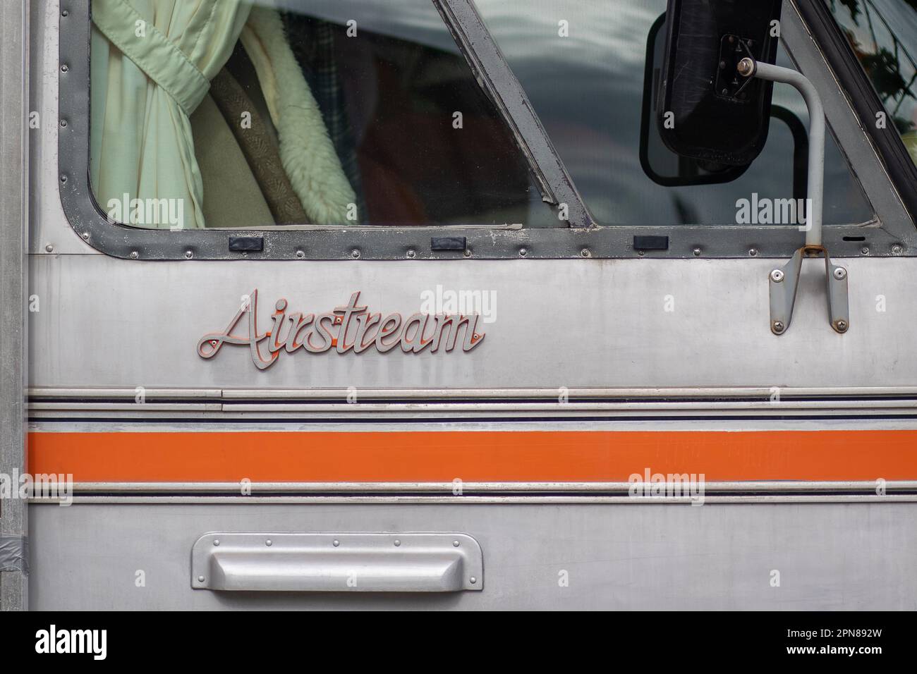 Side door detail of an Airstream camper van parked in a Suffolk market ...