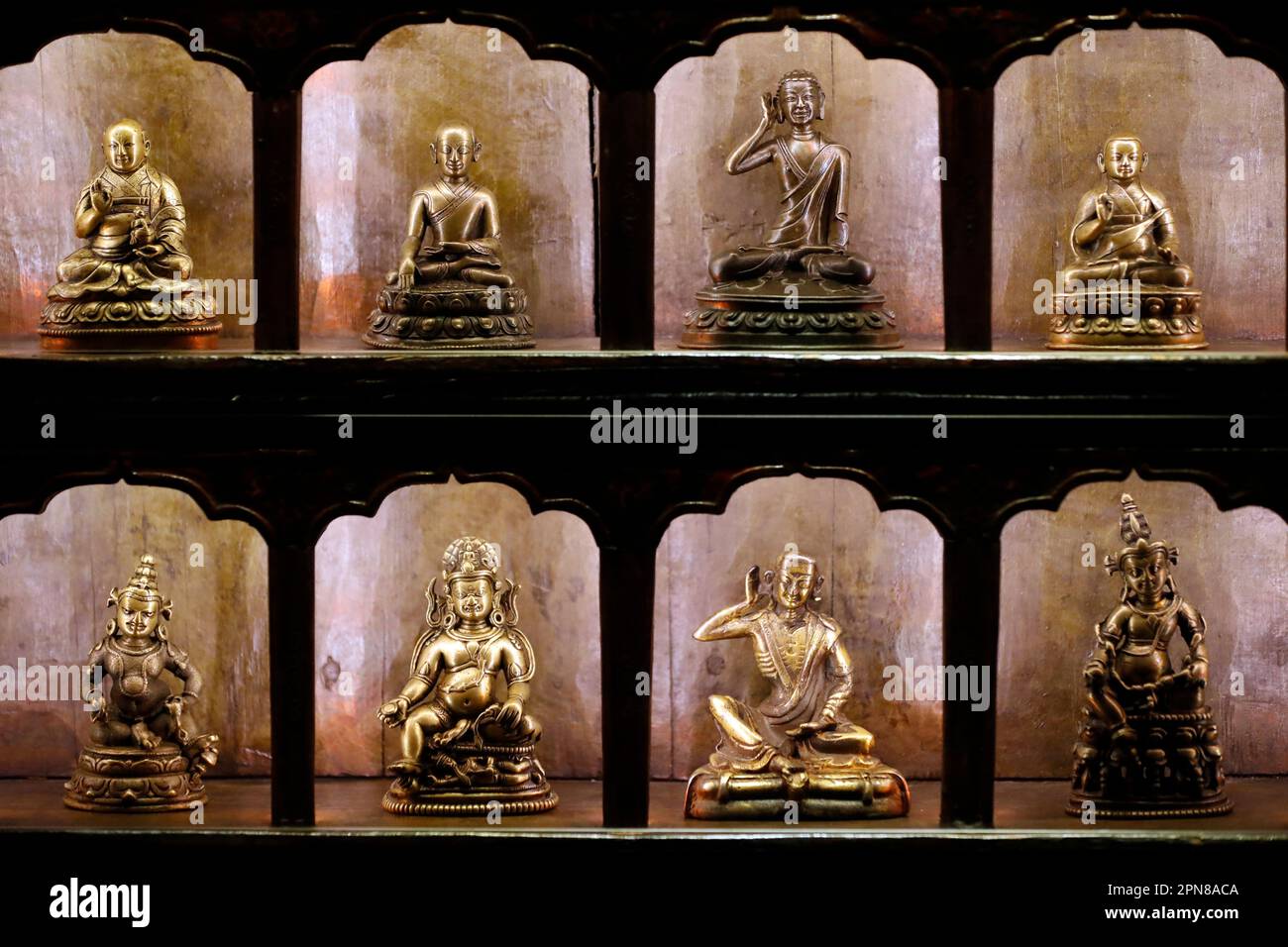 Collection of buddhist figurines Stock Photo - Alamy