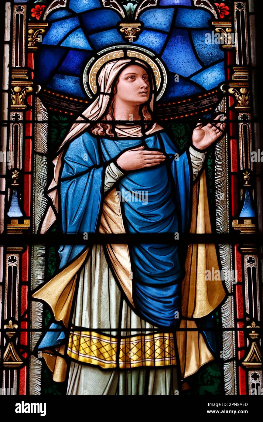 Stained glass. The Virgin Mary in blue dress. Geneva. Switzerland Stock ...
