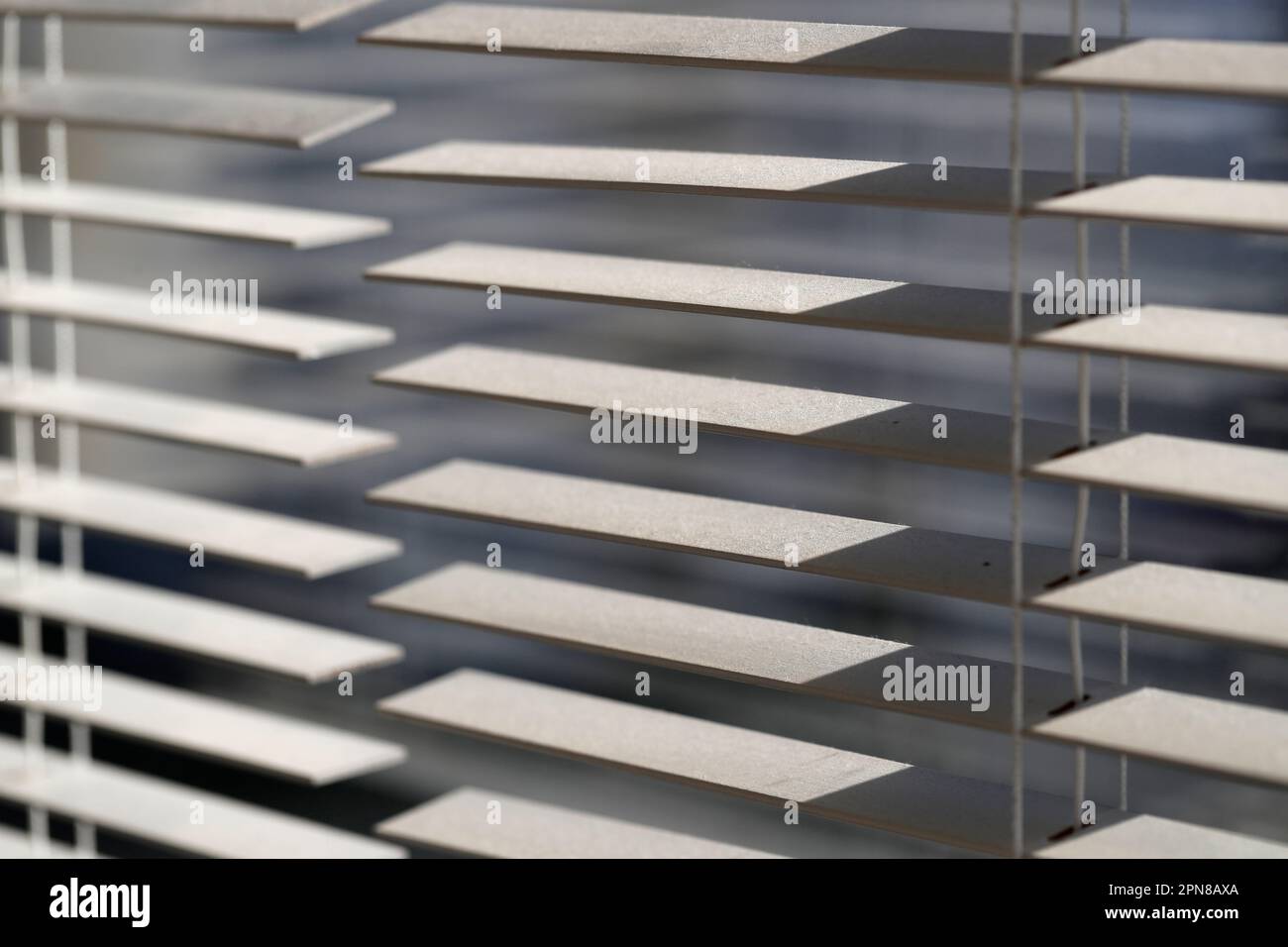 Sunlight coming through venetian blinds by the window Stock Photo - Alamy