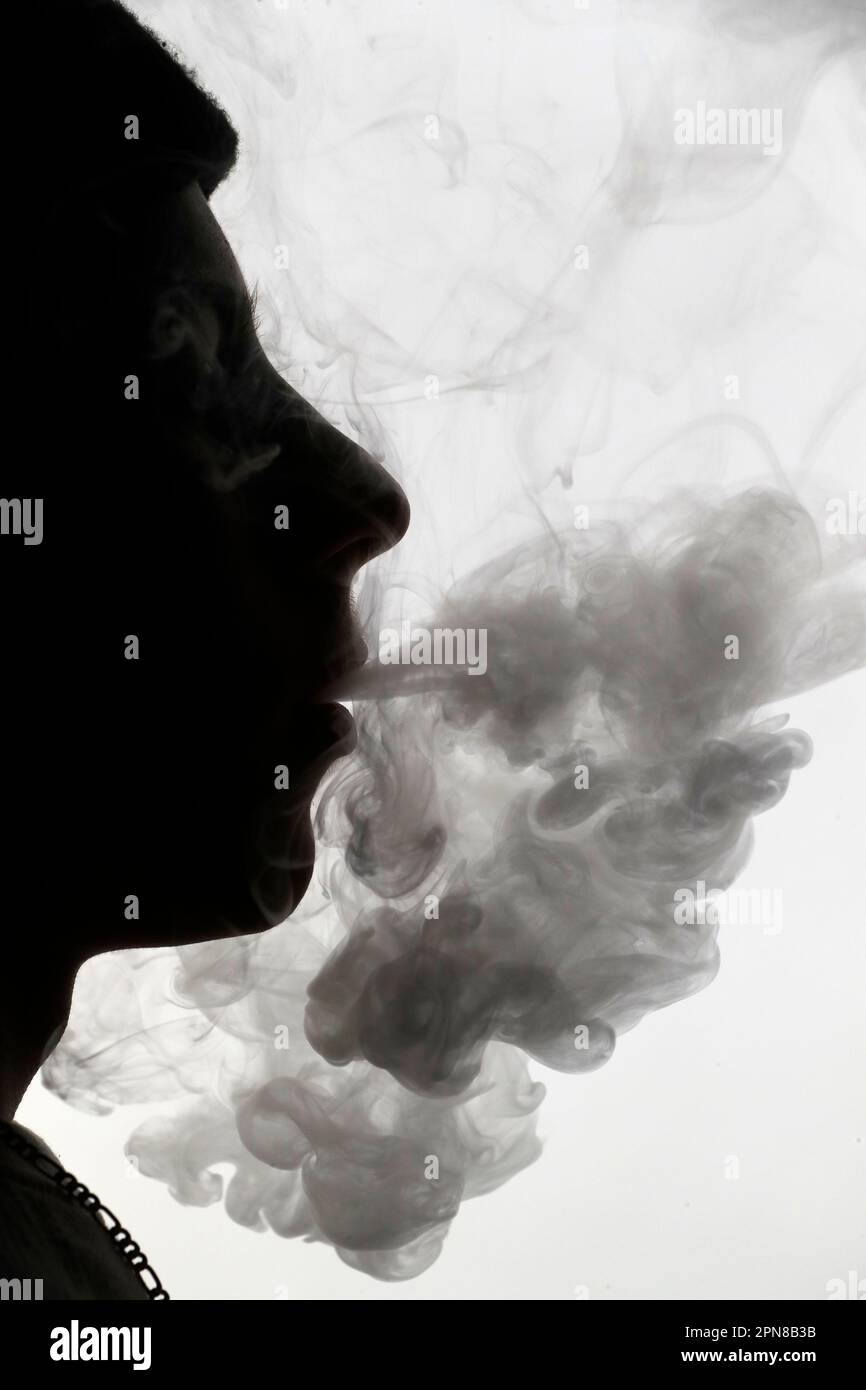 Profile Silhouette of a Man Smoking on White Background Stock Photo - Alamy