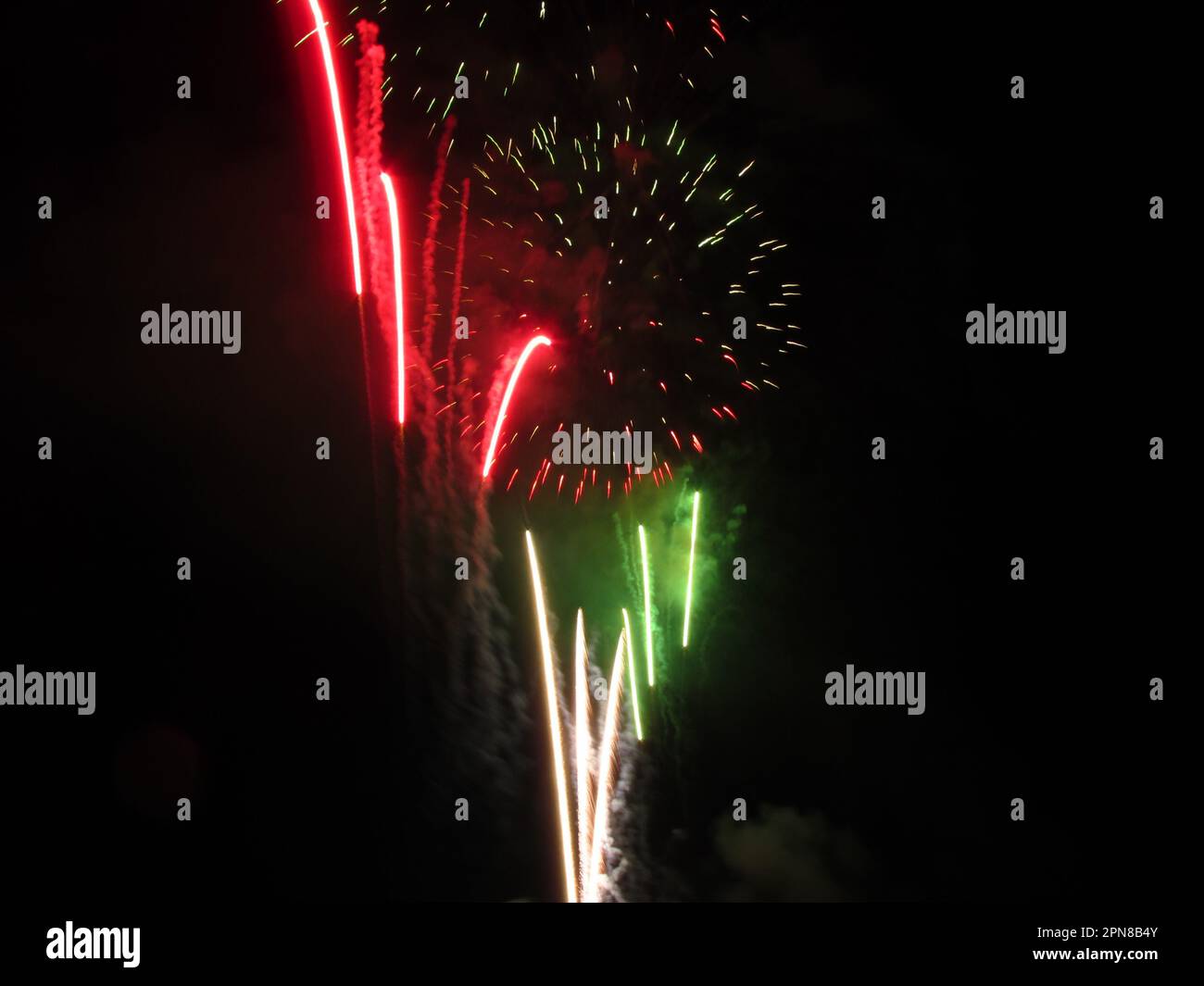 Colorful fireworks of various colors light up the night sky Stock Photo ...
