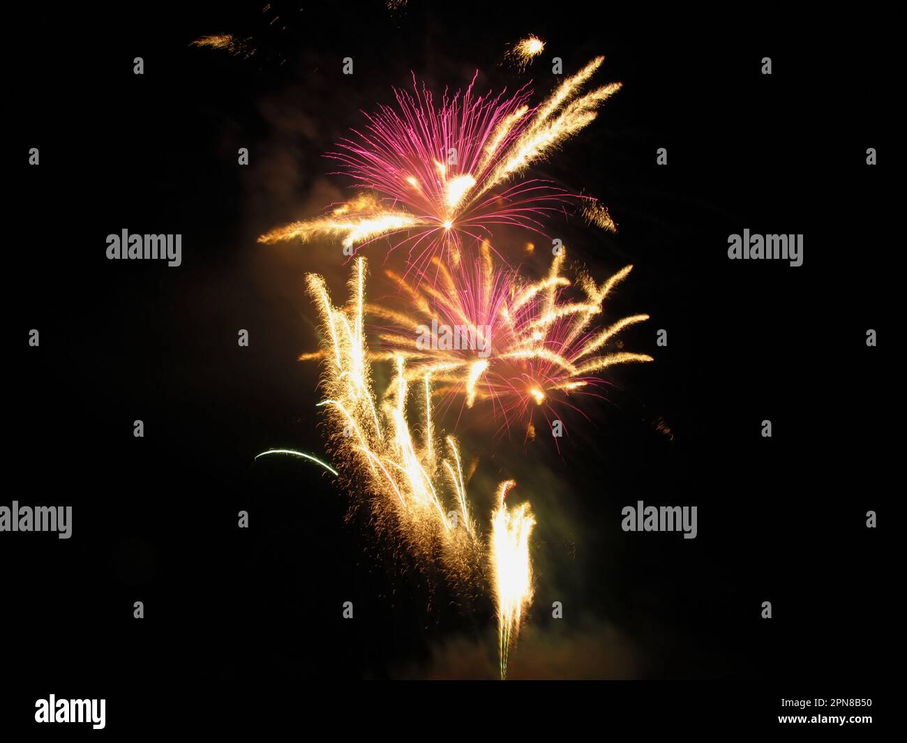 Colorful fireworks of various colors light up the night sky Stock Photo ...