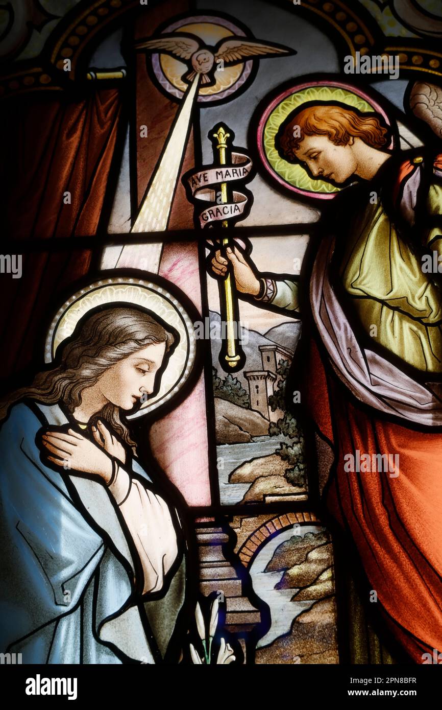Stained glass. The Annunciation is the announcement by the angel Gabriel to the Virgin Mary that ...
