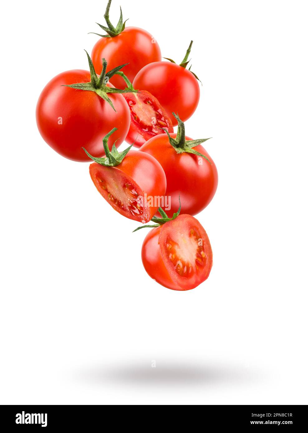 Small red cherry tomatoes floating on white background Stock Photo - Alamy