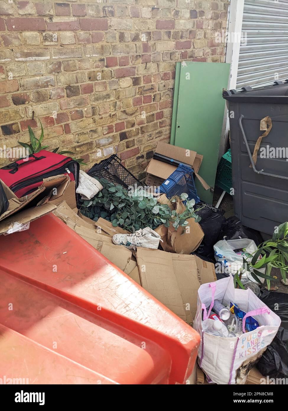 Rubbish Pile and Bins Behind a Local Corner Shop Alley Way Stock Photo ...