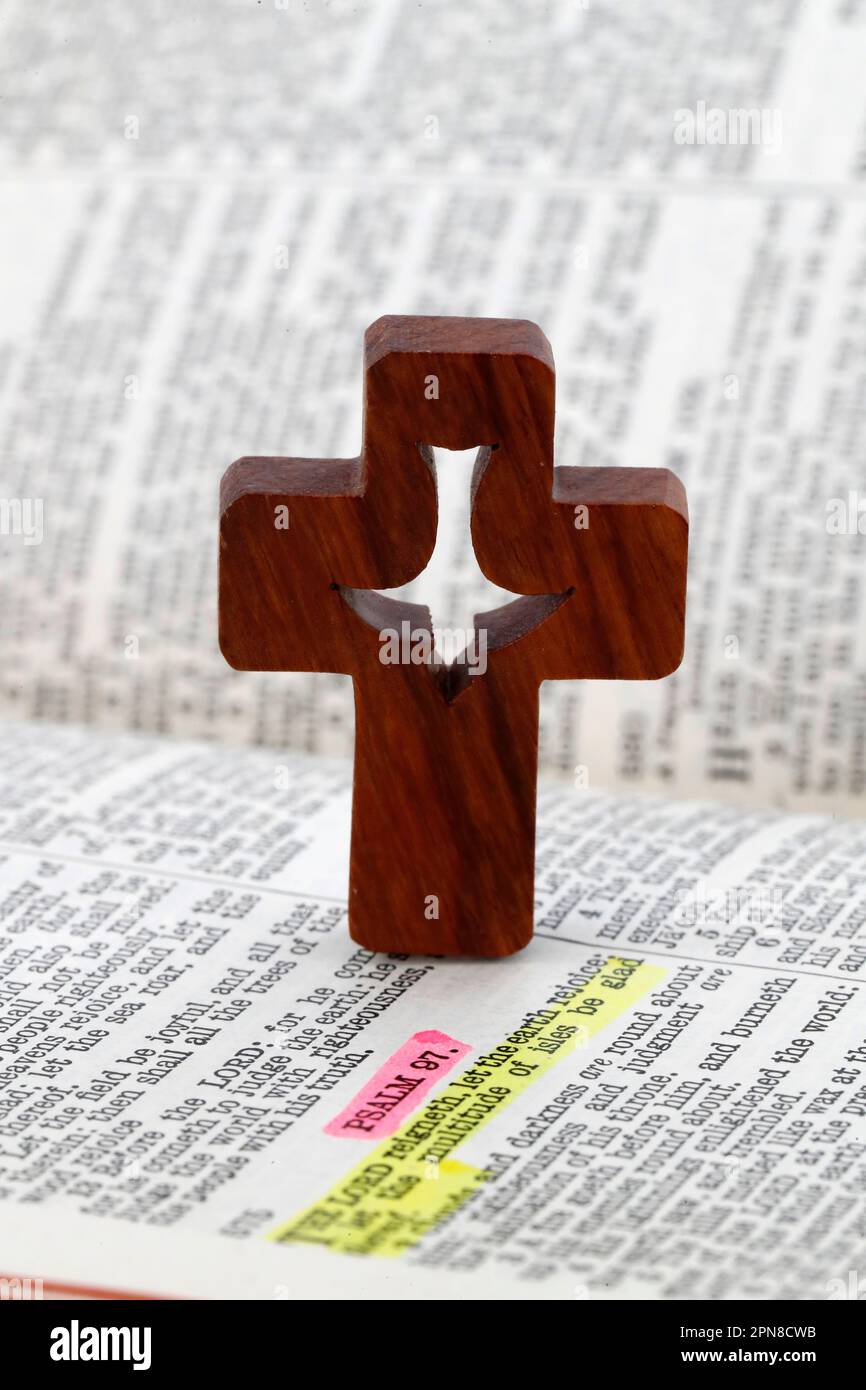 Open bible with christian cross and dove holy spirit Stock Photo - Alamy