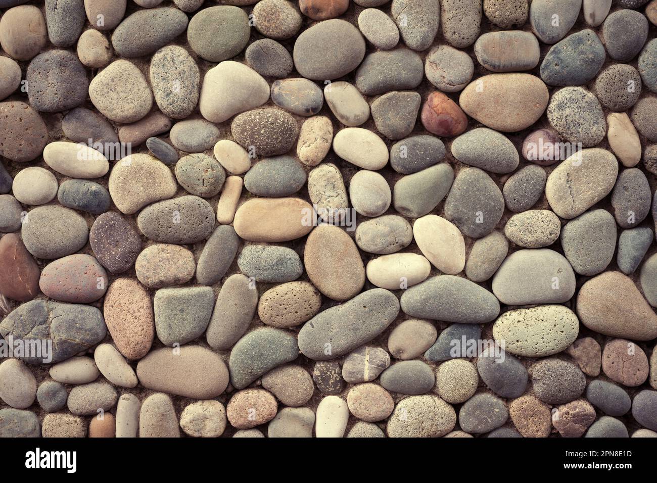 An abstract background of sea pebbles Stock Photo - Alamy