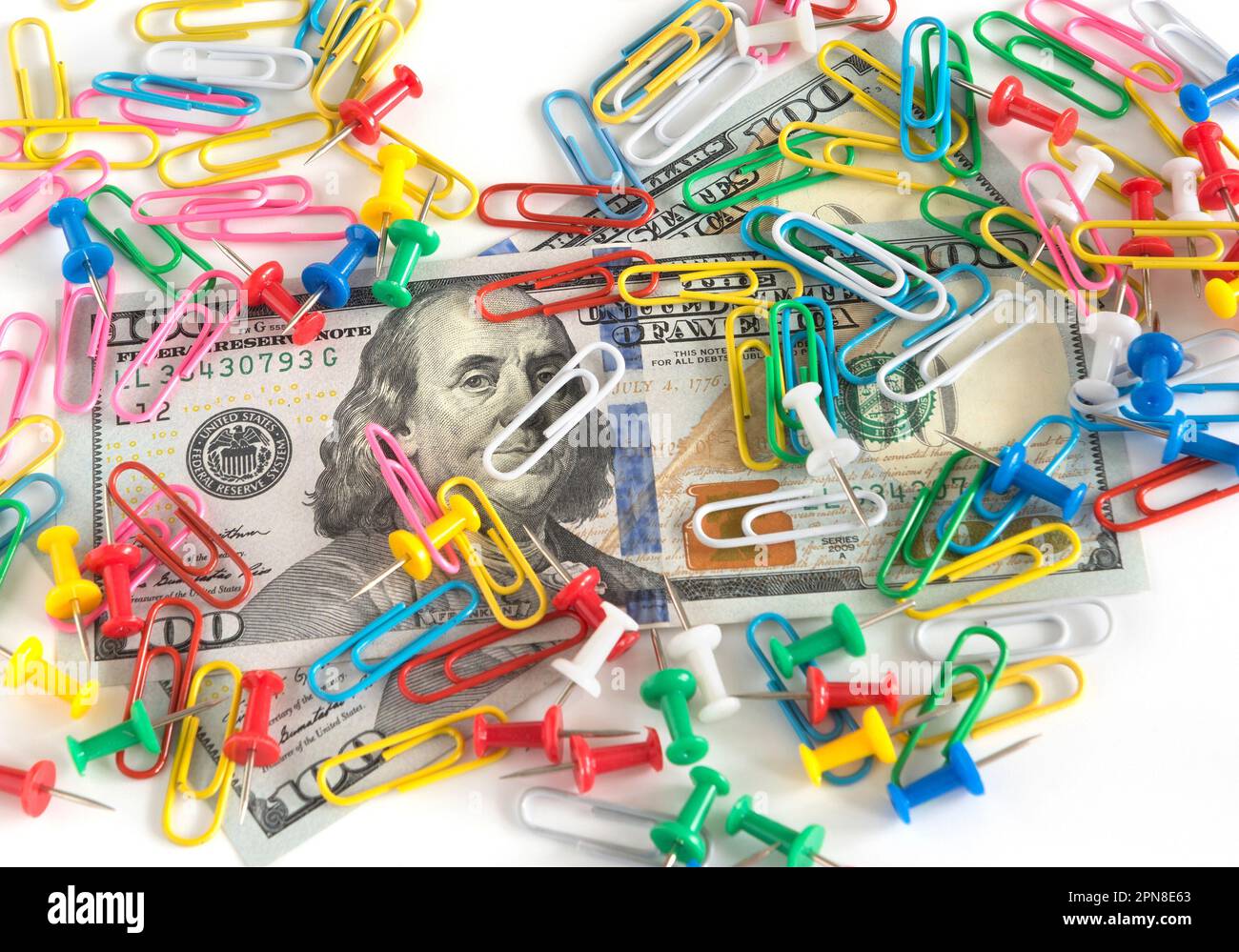 Colorful paper clips and stationery buttons isolated on white ...