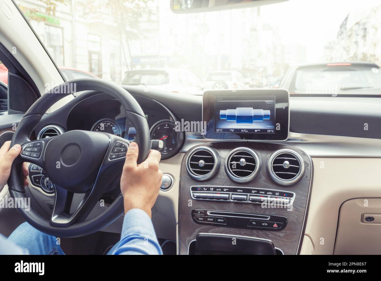 Human driving a car, view from inside. A man is in the salon of car ...
