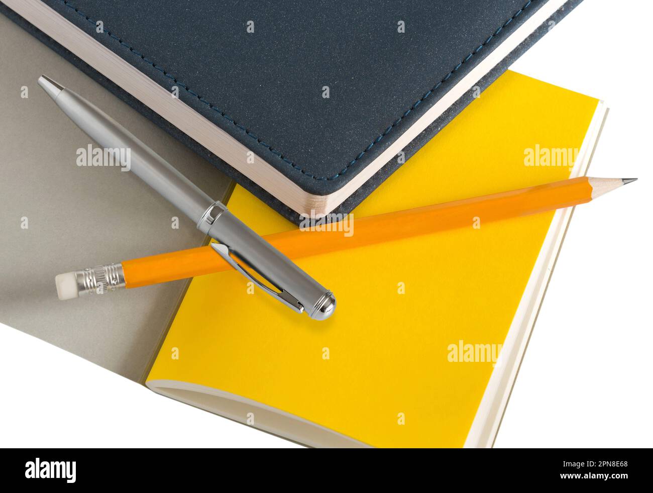 Notebook, pen and pencil isolated on white background. Top view. Office ...