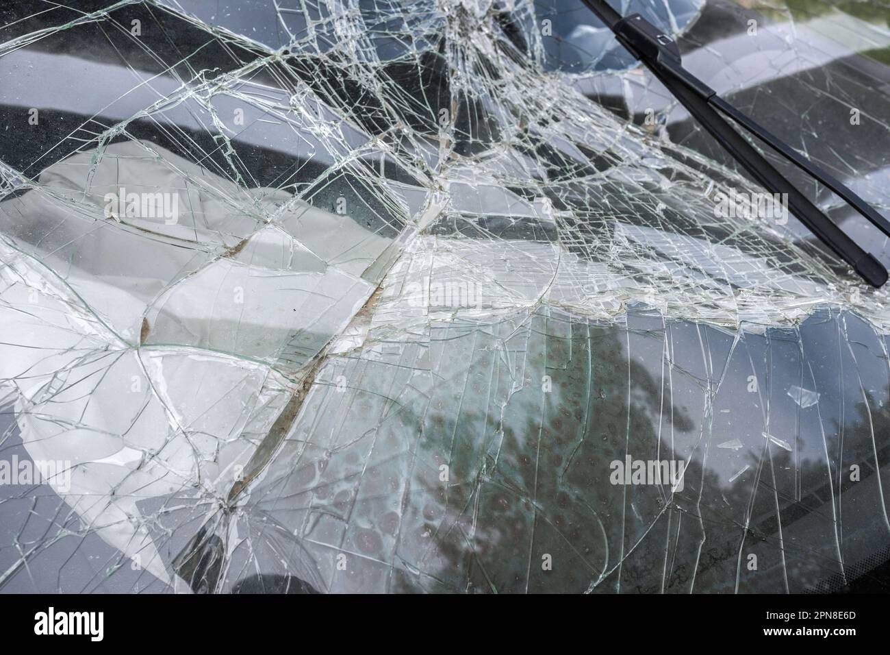 The broken windshield in car accident. Beaten frontal glass Stock Photo ...