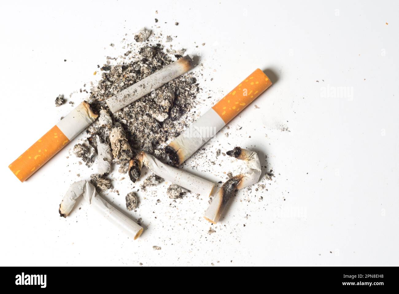 Cigarette burns at the white background Stock Photo - Alamy