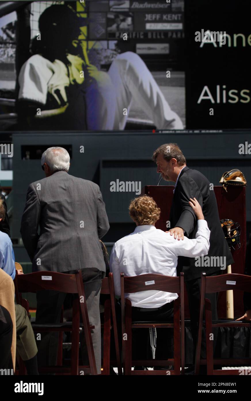 Corey Busch(right), father of Alexis Busch lays his hand on the ...