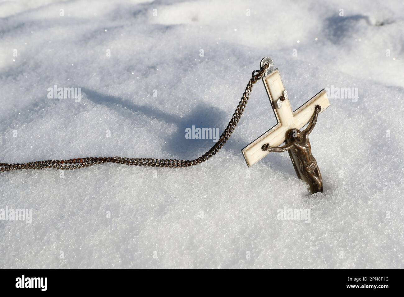 Old pendant in the snow with Jesus christ crucified. Crucifix Stock ...
