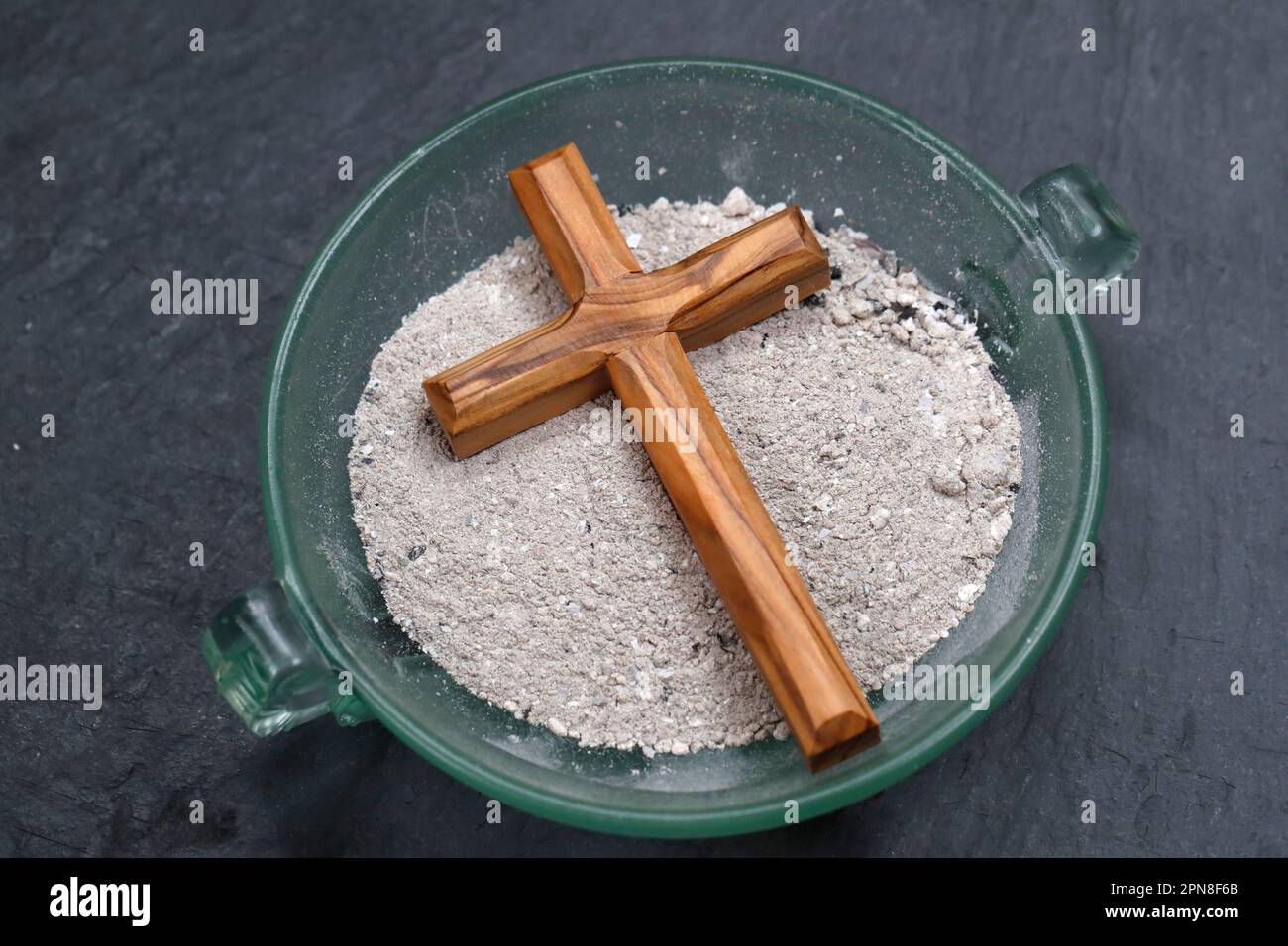 Ashes and wooden christian cross. Ash Wednesday celebration. Lent ...