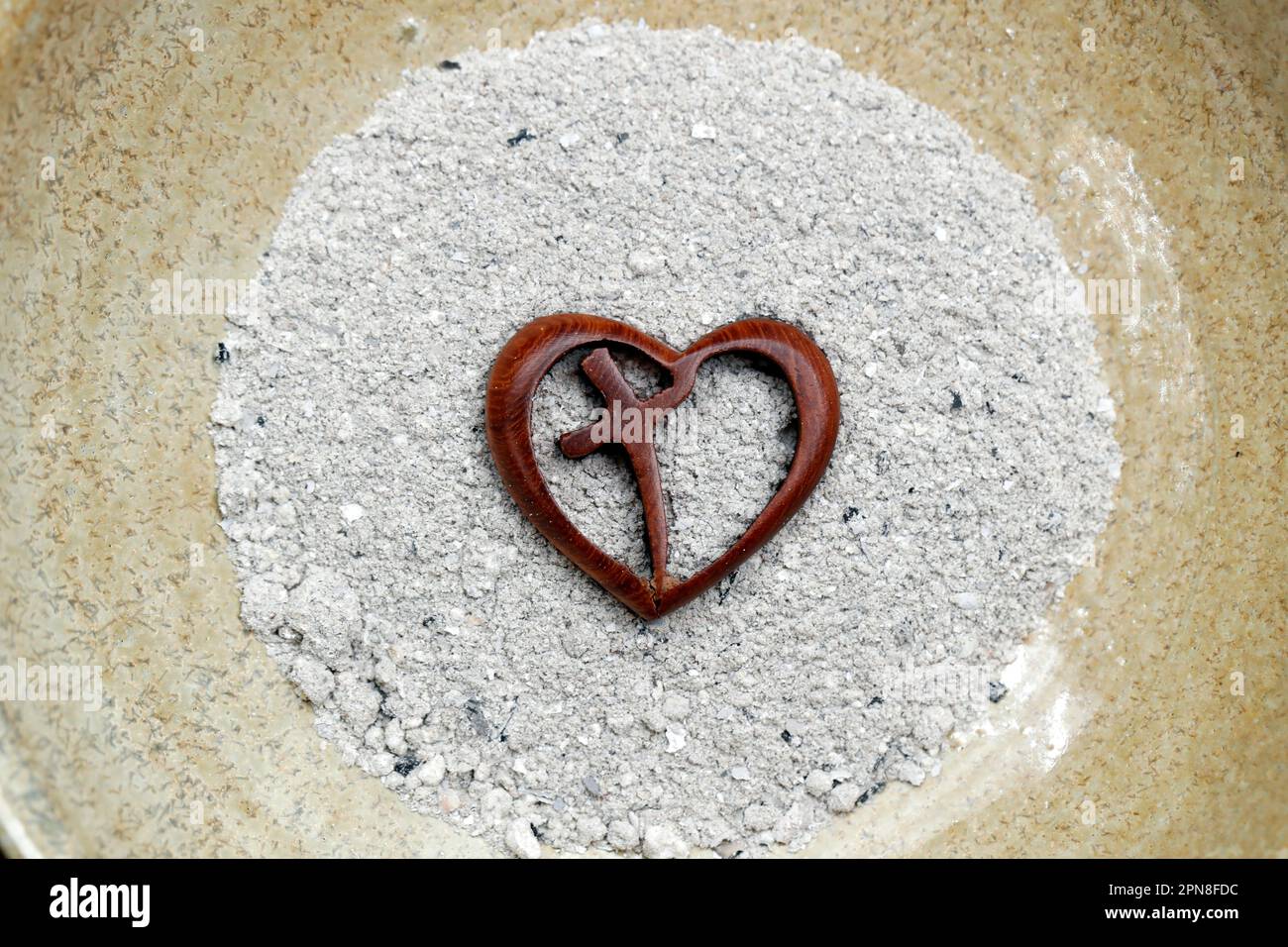 Ashes and christian cross with heart. Ash Wednesday celebration. Lent ...