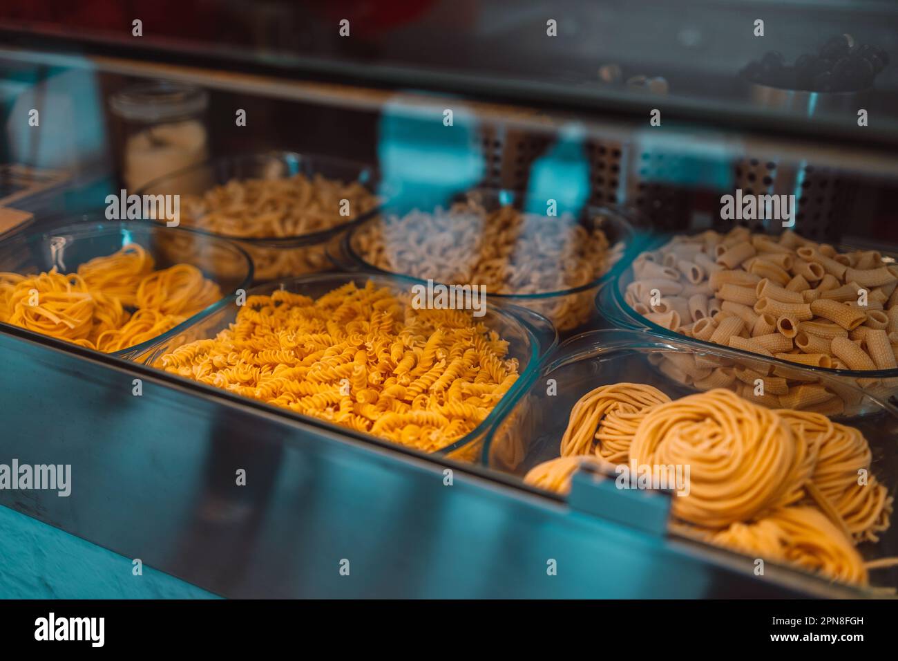 Traditional Italian pasta products displayed at the window of a local ...