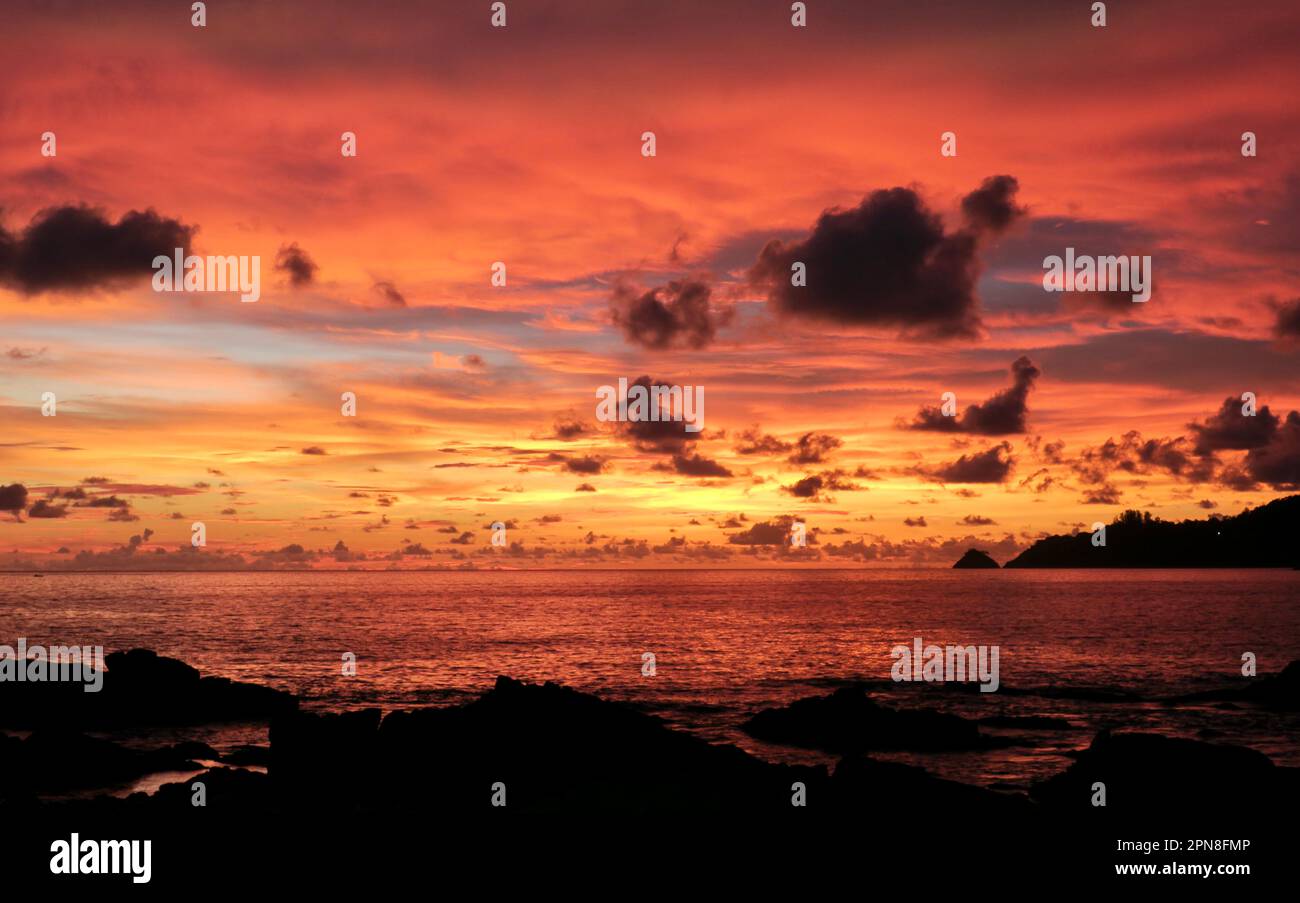 Colorful sunset at Kalim beach in Phuket island in Thailand Stock Photo ...
