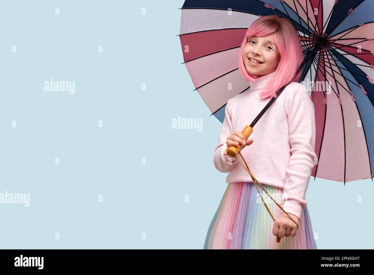 Portrait teenager with alternative look on blue background studio. Teen ...