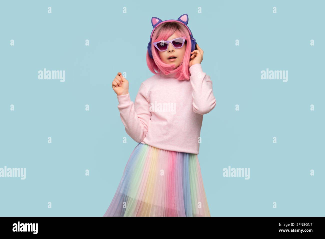 Zoomer girl with pink hair wig, 10-12 y. o., wears pastel-colored ...