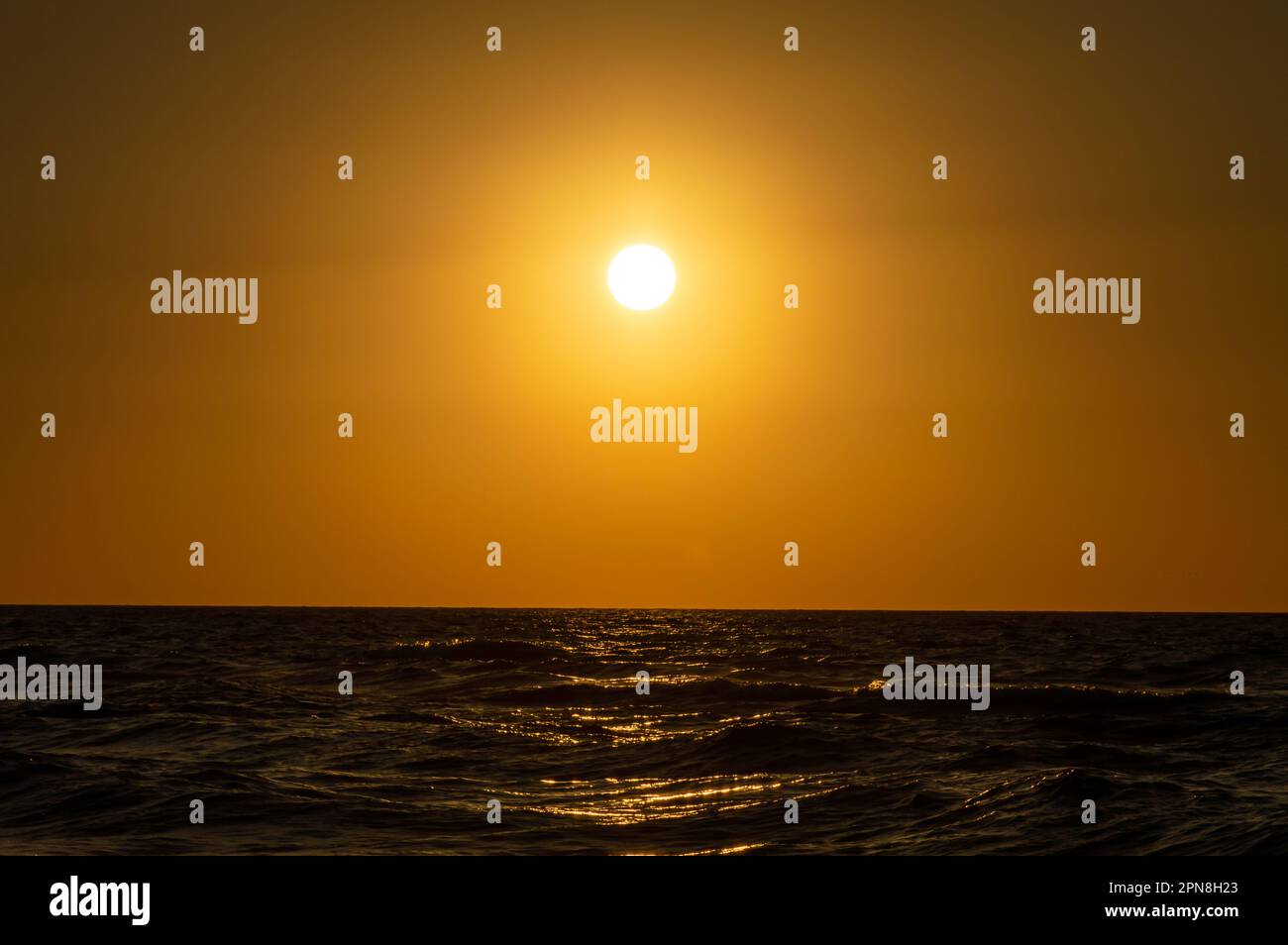 Gold sunrise on the beach Stock Photo - Alamy