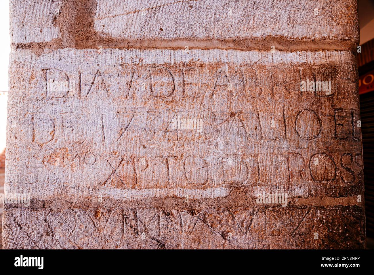 Stone inscription on one of the columns, 1734. Plaza Chica of Zafra is ...