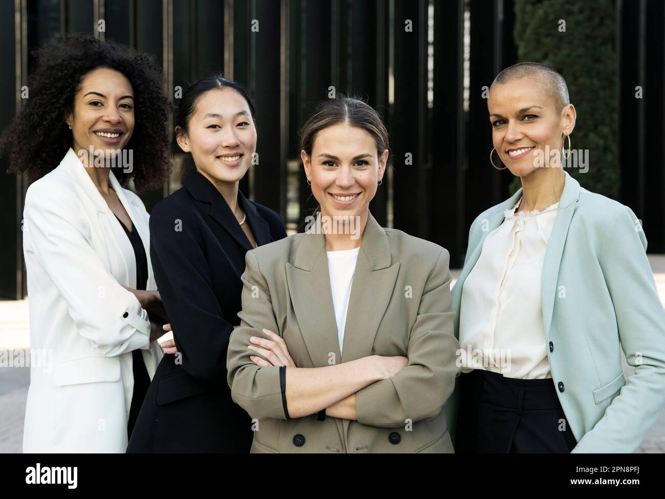 Multiracial group of successful confident women office corporate ...