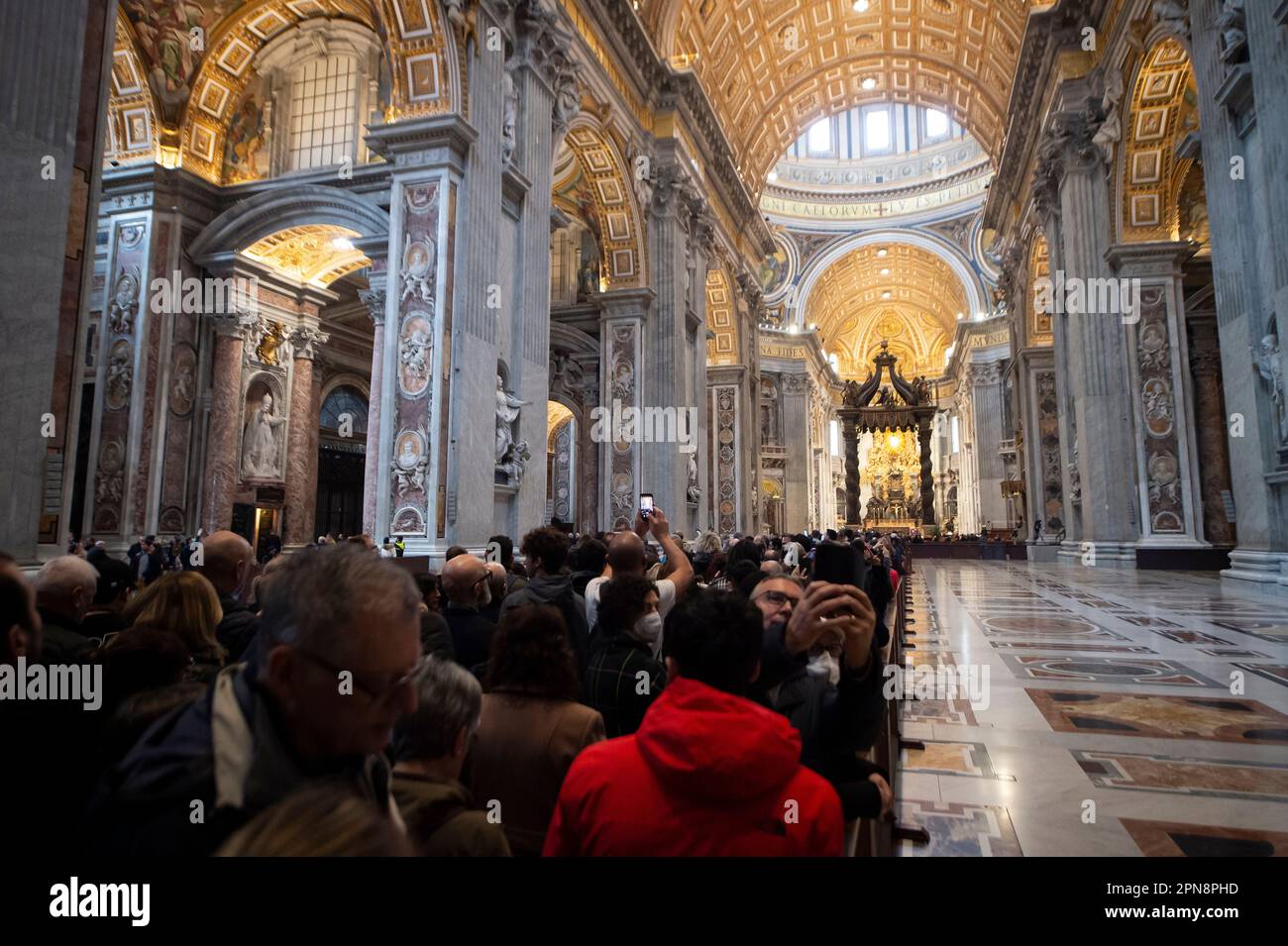 People wait in line to see the body of Pope Emeritus Benedict XVI lays ...