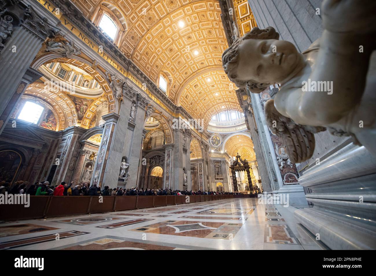 People wait in line to see the body of Pope Emeritus Benedict XVI lays ...