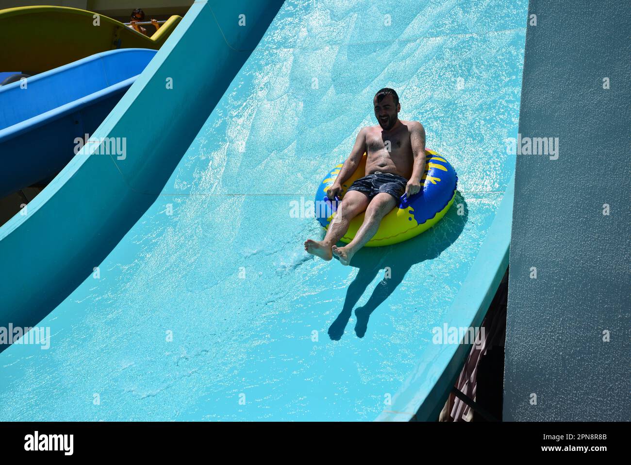 People sliding in the slide pool at the hotel Stock Photo - Alamy