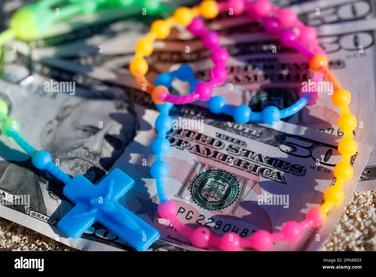 Money and religion prayer beads hi-res stock photography and images - Alamy