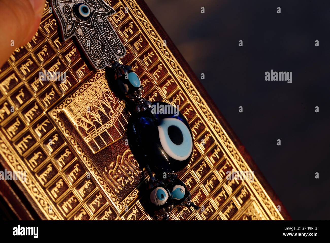 The cover of the Holy Quran (Koran) with the 99 names of Allah in ...