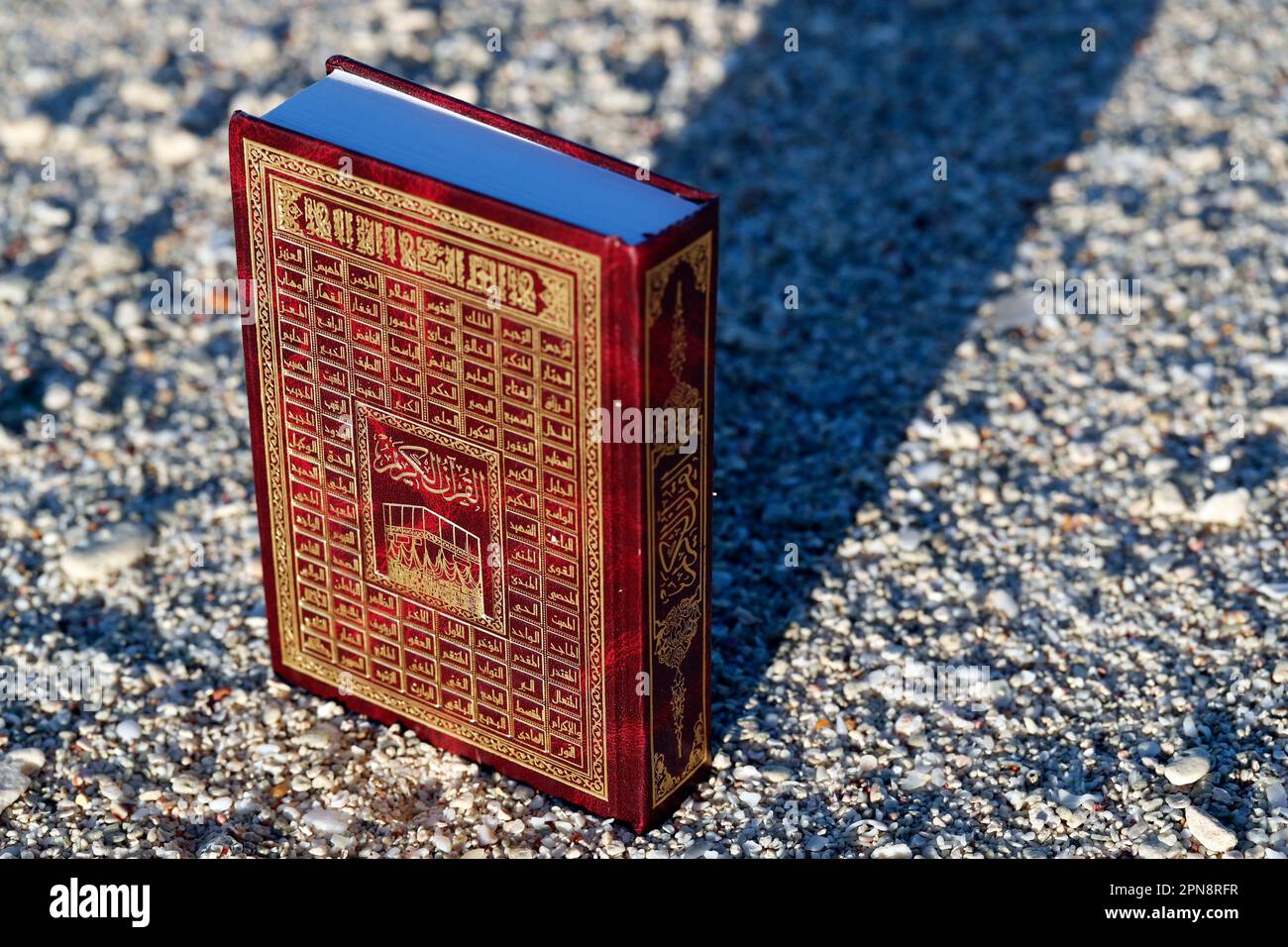 The cover of the Holy Quran (Koran) with the 99 names of Allah in ...