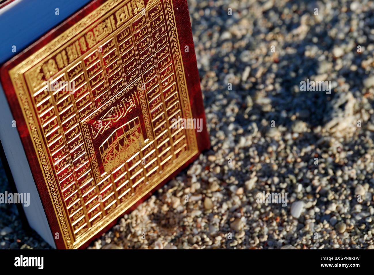The cover of the Holy Quran (Koran) with the 99 names of Allah in ...