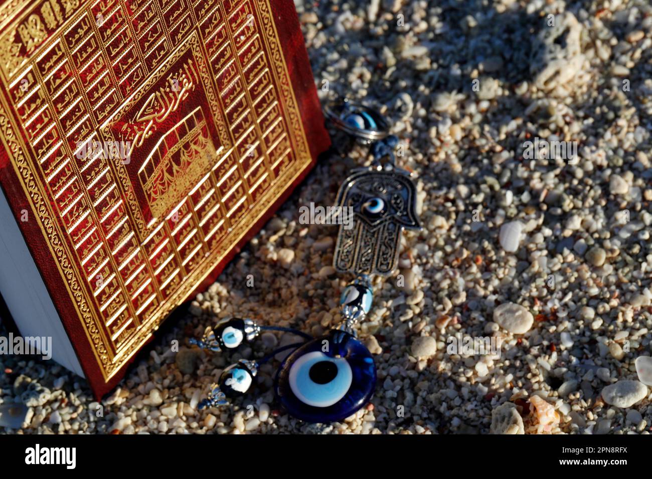 The cover of the Holy Quran (Koran) with the 99 names of Allah in ...
