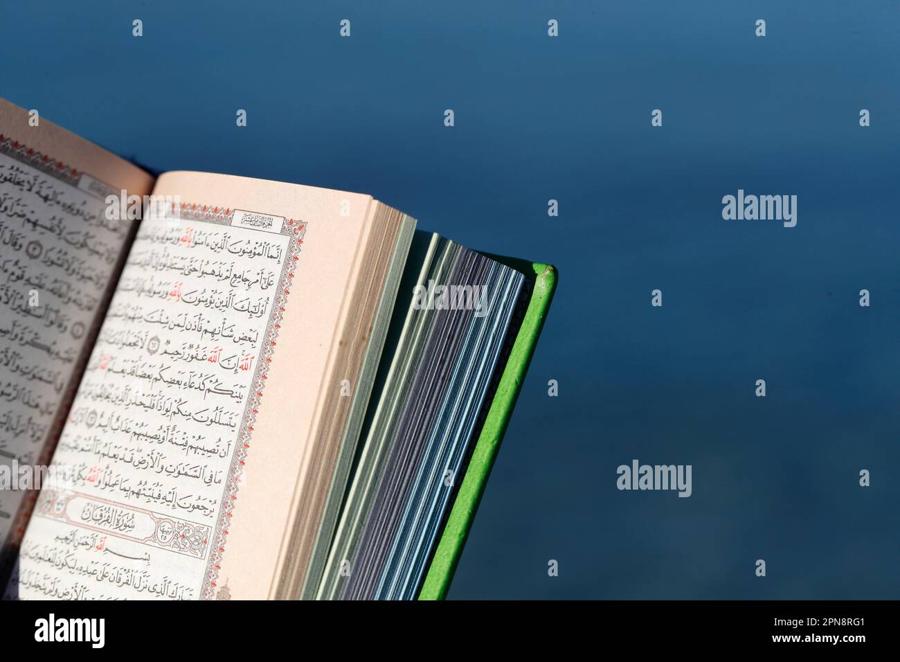 Open Holy Quran in arabic Stock Photo - Alamy